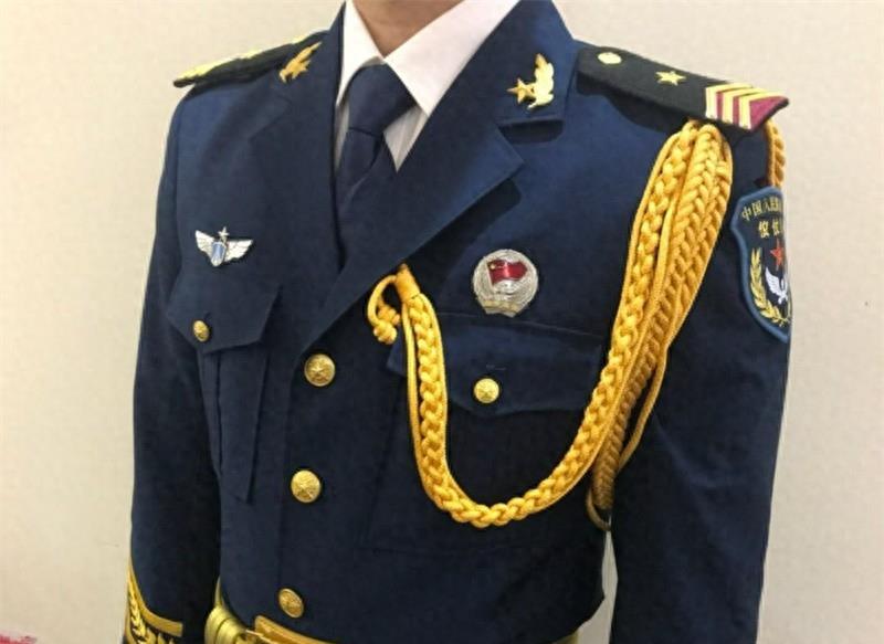 What is the "yellow rope" hanging on the military uniforms of various ...