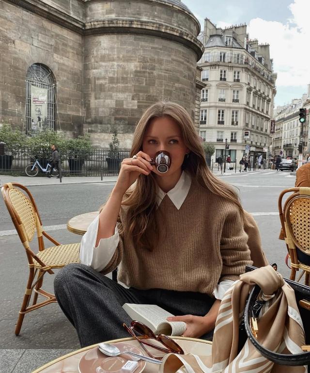 German fashion blogger Livia Auer wears retro and fashionable Parisian ...