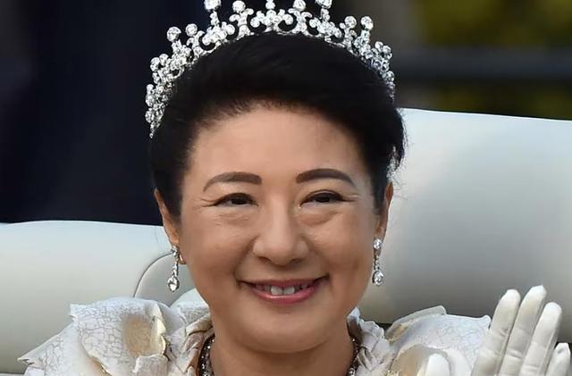 Queen Masako is as pale as a chrysanthemum, dressed in a dignified and ...