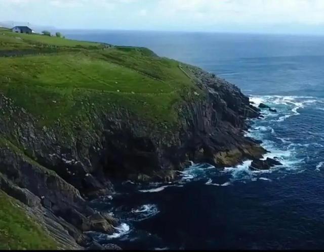 Lonely lighthouses, castles, small houses on the coast of cliffs ...