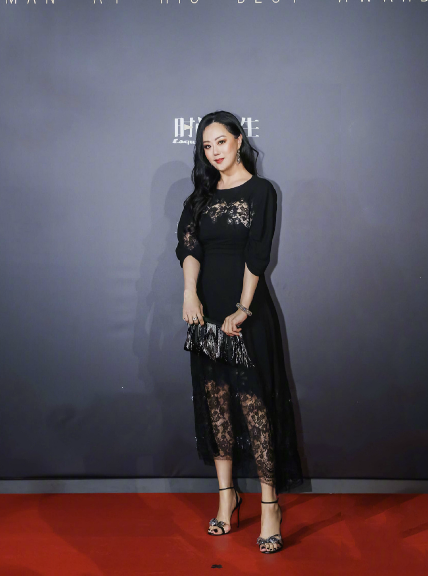 Former Hong Kong socialite Zhang Xiaohui, wearing a couture dress to ...