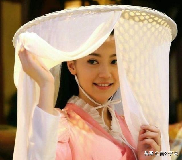 20 beautiful women in costumes with veil and hats, at the moment of ...