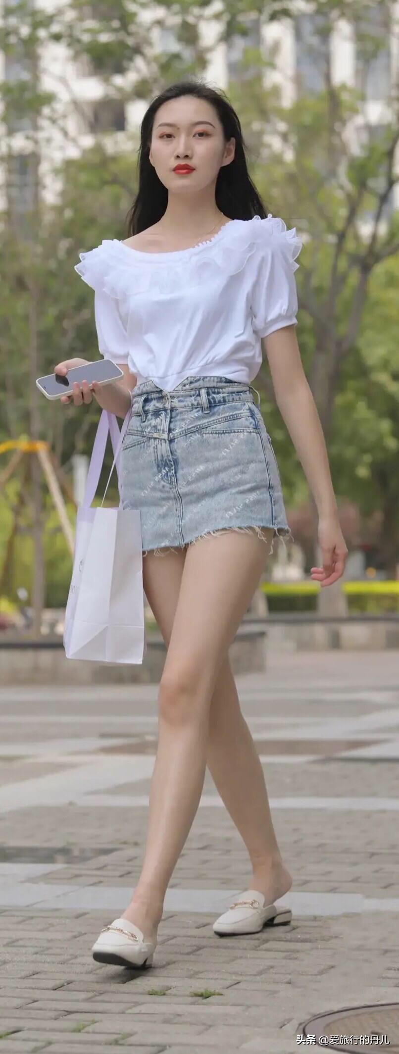 White big round neck shirt with blue denim skirt pants, exuding an ...