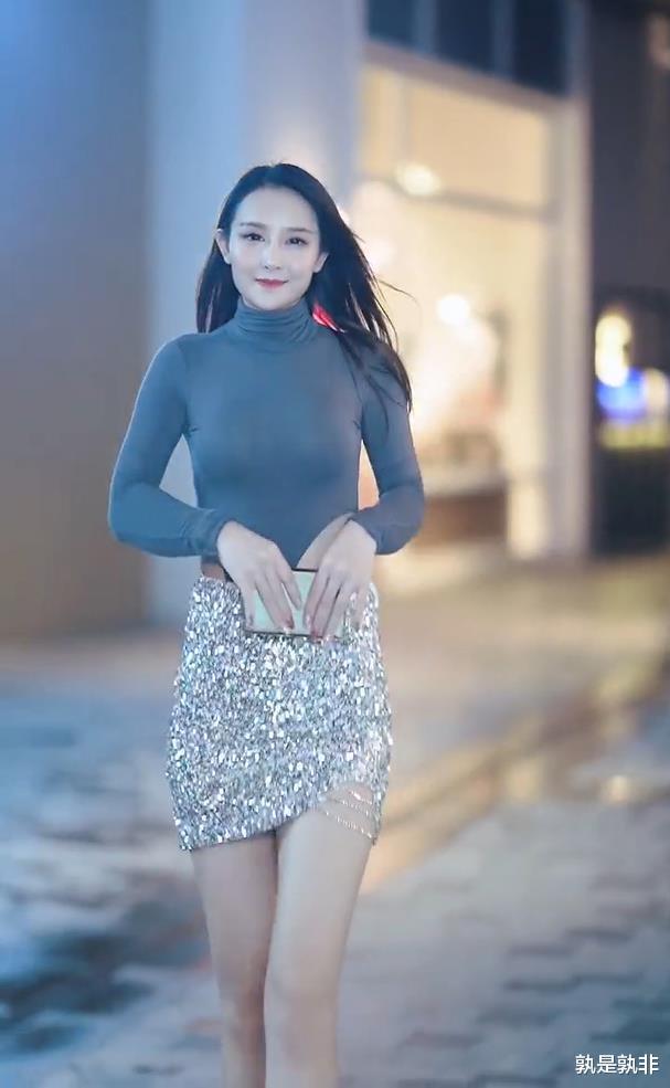 Fashionable one-piece suits and short silver skirts make this sister a ...