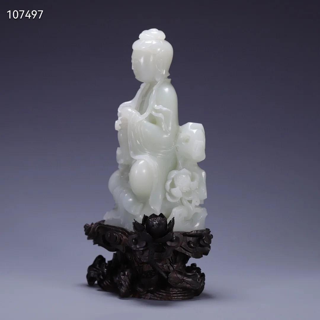 Hetian Yu holding a seated Ruyi Guanyin - iNEWS