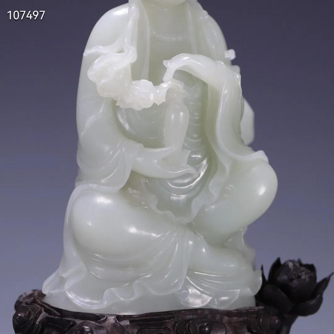 Hetian Yu holding a seated Ruyi Guanyin - iNEWS