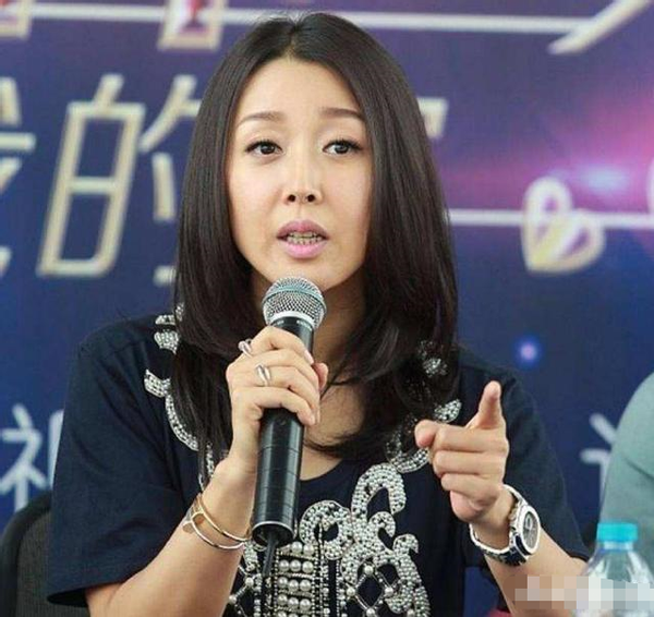 The female singer, Sun Yuehan, shows up, picking coconuts while playing ...