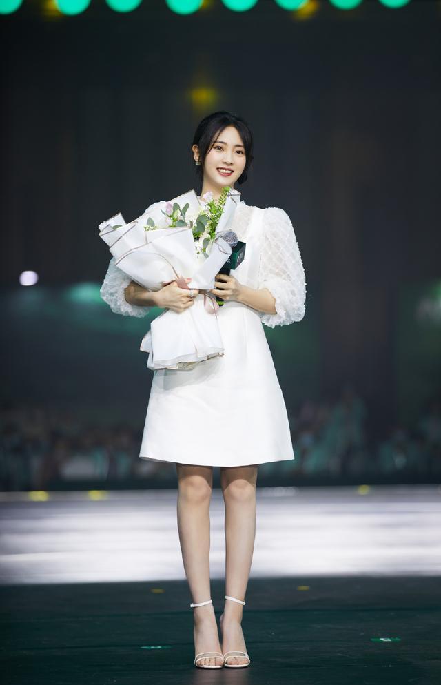 Xing Fei is so sweet in and out of play, wearing a little white dress ...