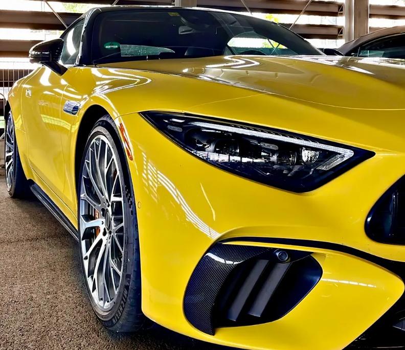 Mercedes-Benz AMG SL real car exposed, with sun yellow paint, it is ...
