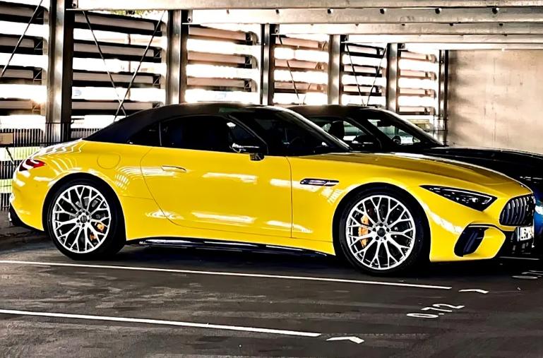 Mercedes-Benz AMG SL real car exposed, with sun yellow paint, it is ...