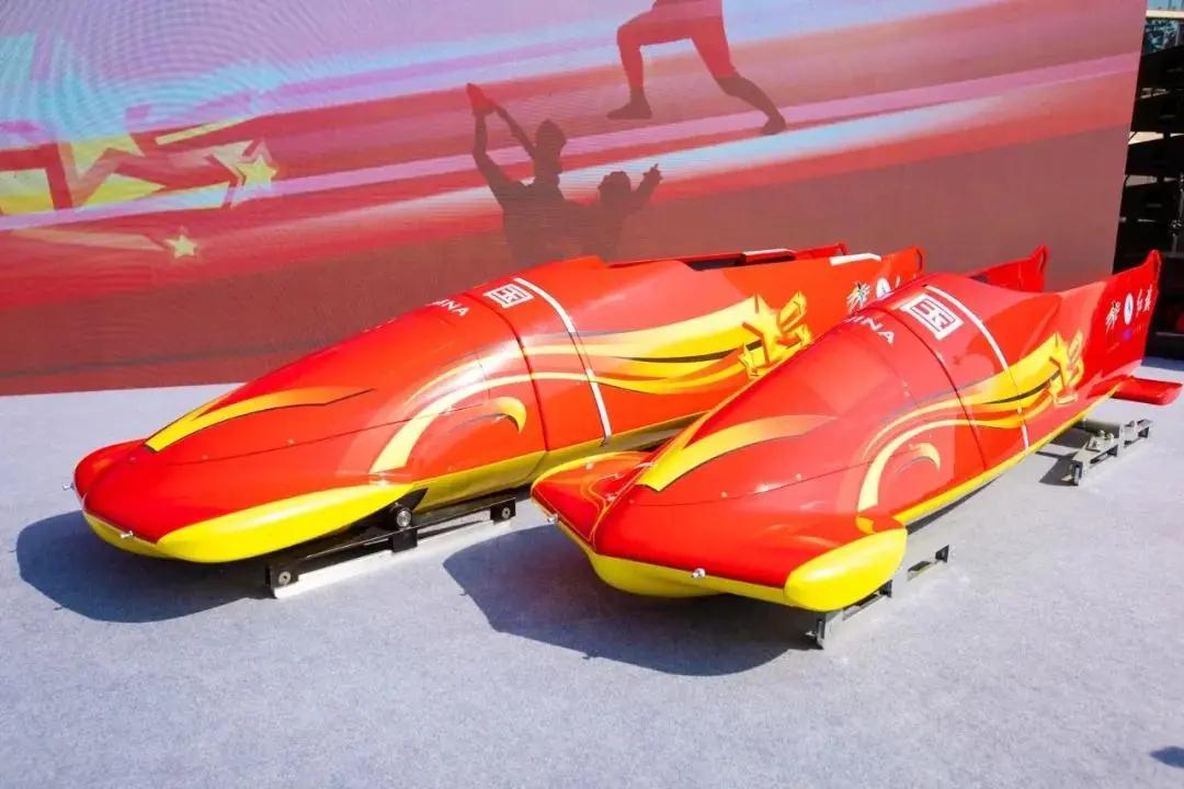 Winter Olympics Red Flag Snowmobile - iNEWS