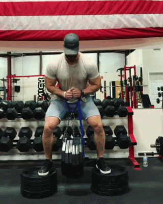 Handsome American muscular guy is 2 meters tall, squats 180 kg with a ...