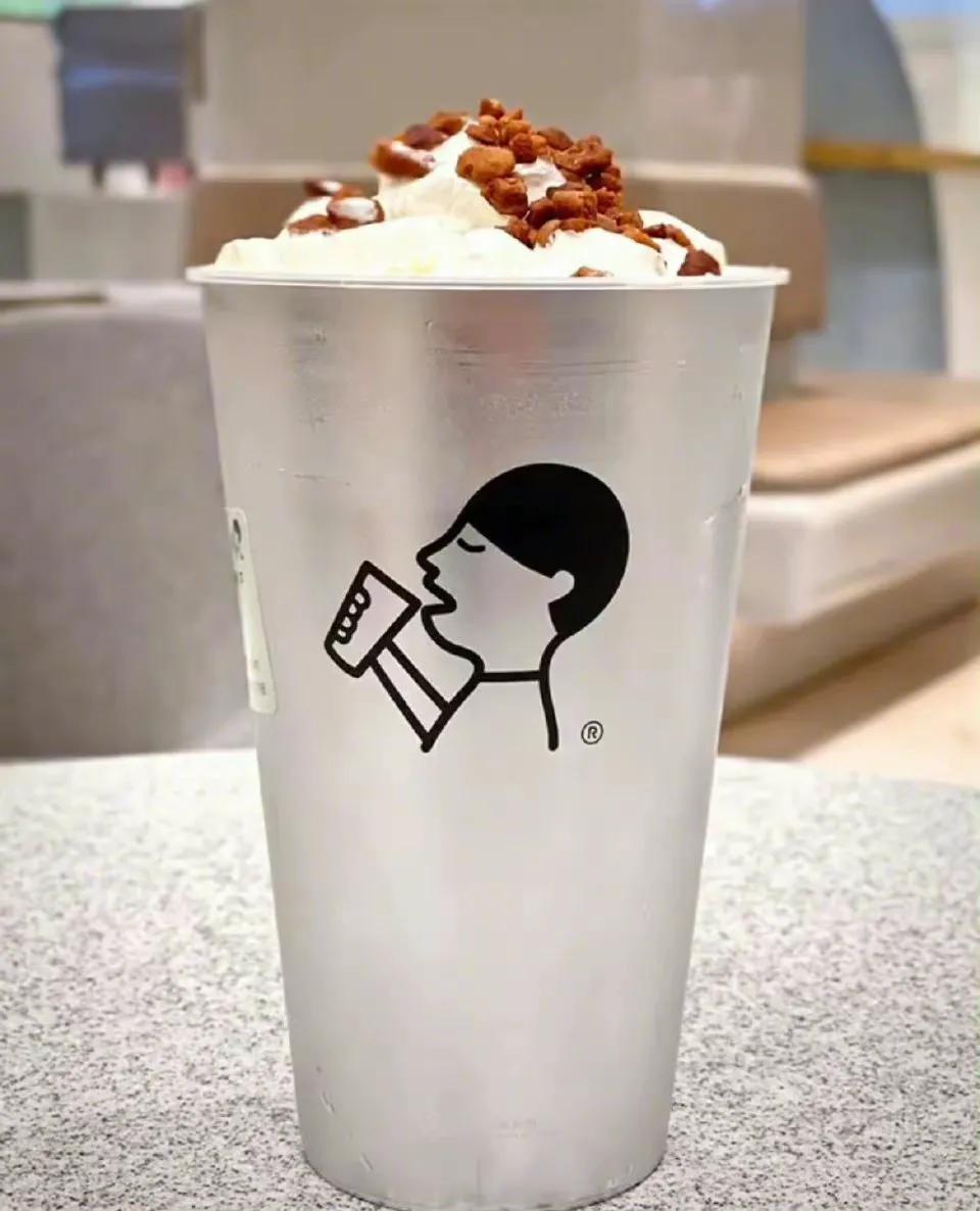 Looking at the full body picture of the Hey Tea Logo, is the milk tea ...