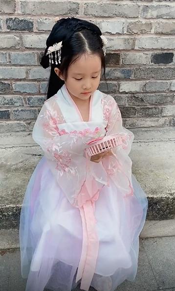 Kuo Tai Gan Wei takes a recent photo of her 6-year-old daughter. She ...