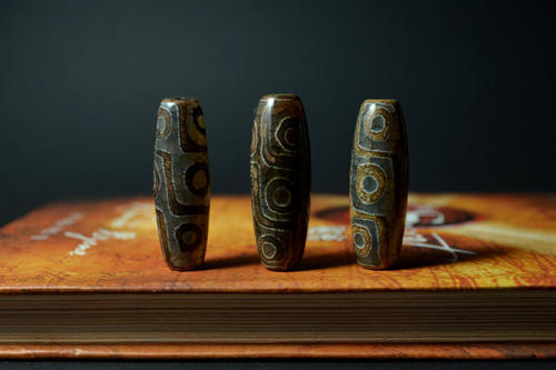 There are only two nine-eyed dzi beads in the world, one of which is ...