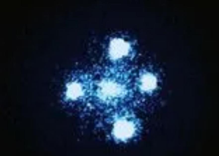 5 billion light-years away from the earth, the Einstein cross really ...