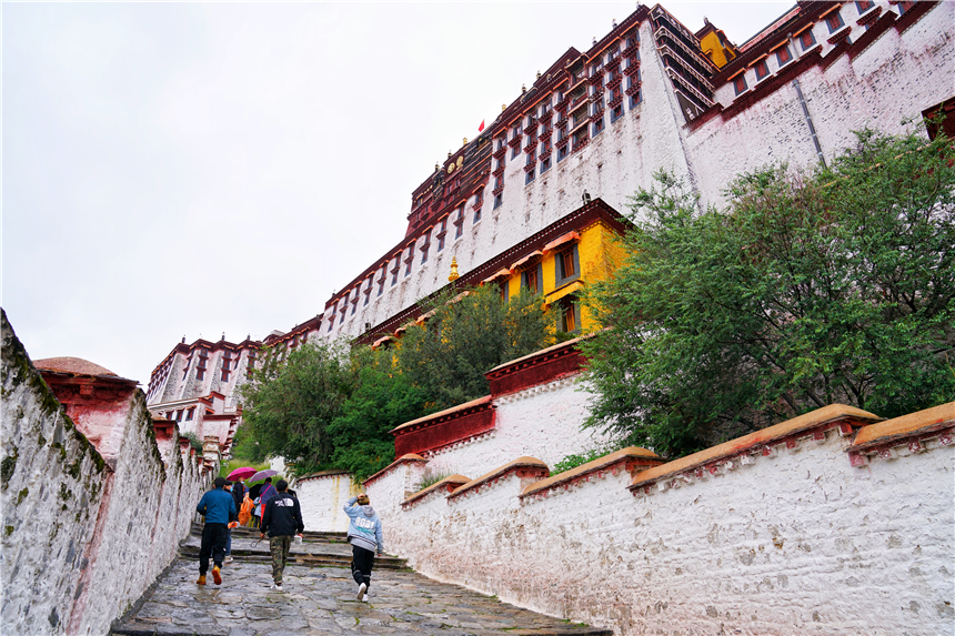 The tallest building in Lhasa, located halfway up the mountain, was ...