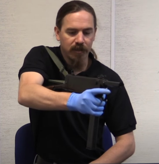 A close relative of the Stern submachine gun, the British one-handed ...