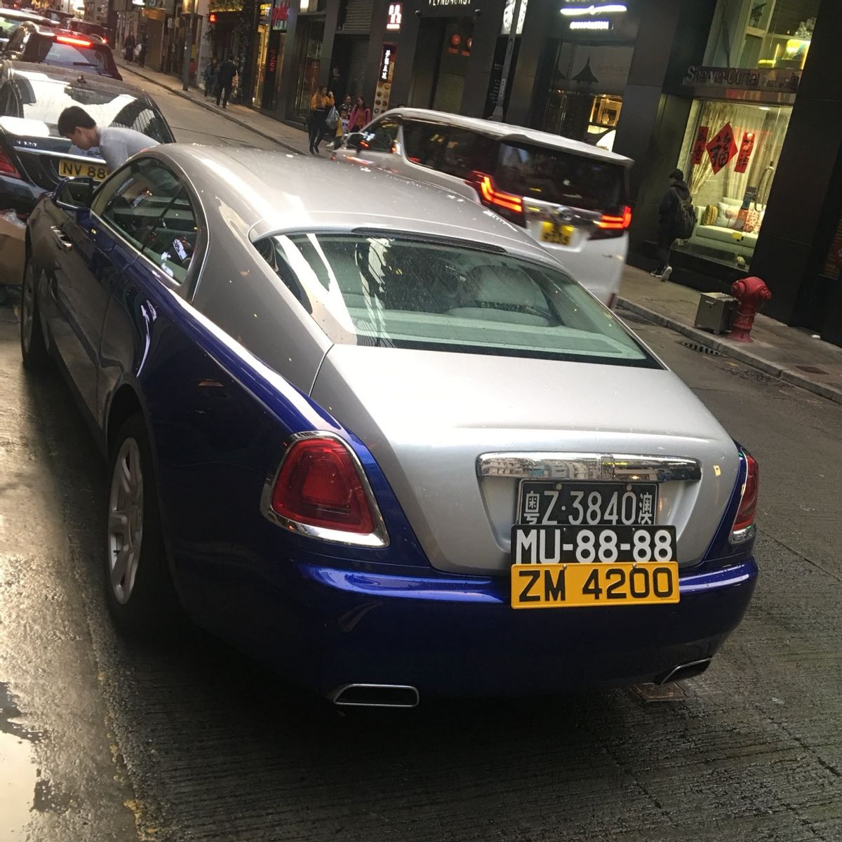 Why does the car have three different license plates, and what do they ...