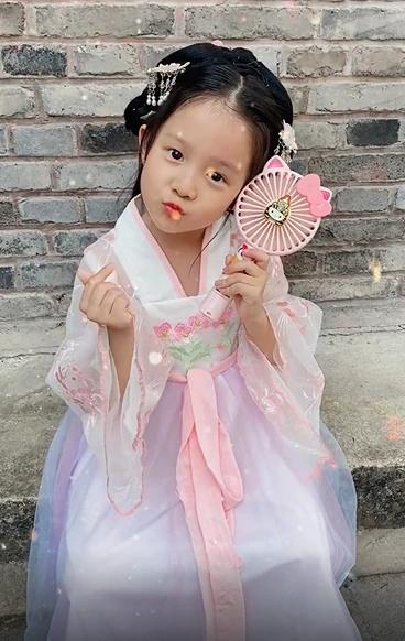 Kuo Tai Gan Wei takes a recent photo of her 6-year-old daughter. She ...