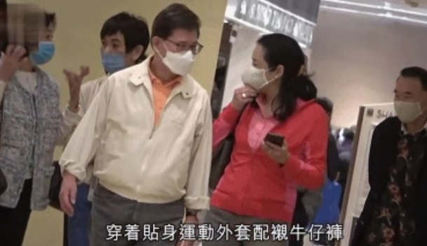 62-year-old Zhu Lingling accompanies her husband to go shopping, after ...