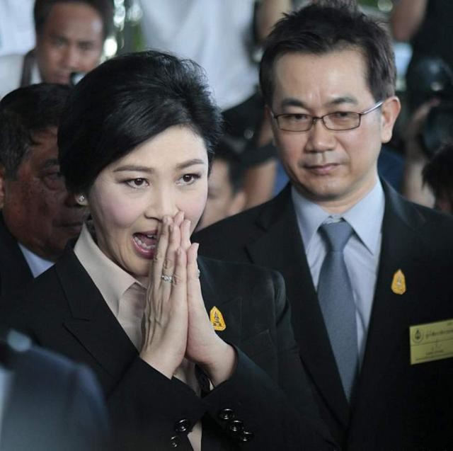 Yingluck's “good helper”: 25 years of company, with her son, living in ...