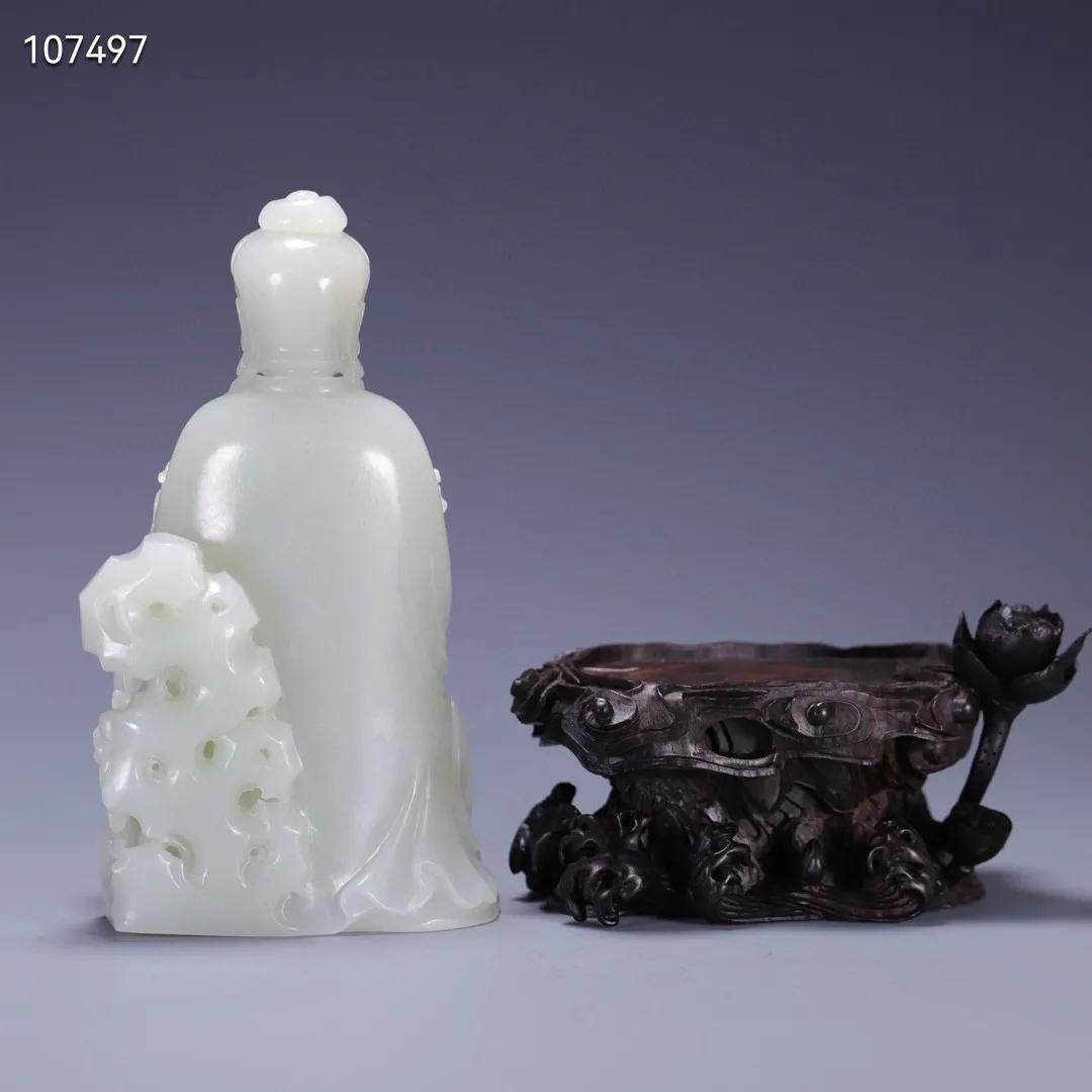Hetian Yu holding a seated Ruyi Guanyin - iNEWS
