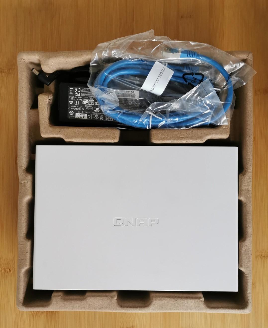 A remote networking artifact with dual 10G Ethernet ports: QNAP QHora ...