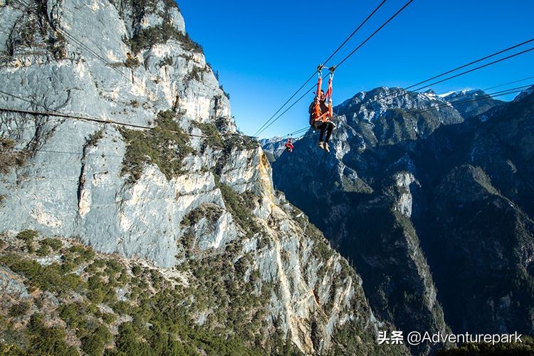 Zipline at high altitude, across mountains and lakes, sliding ...