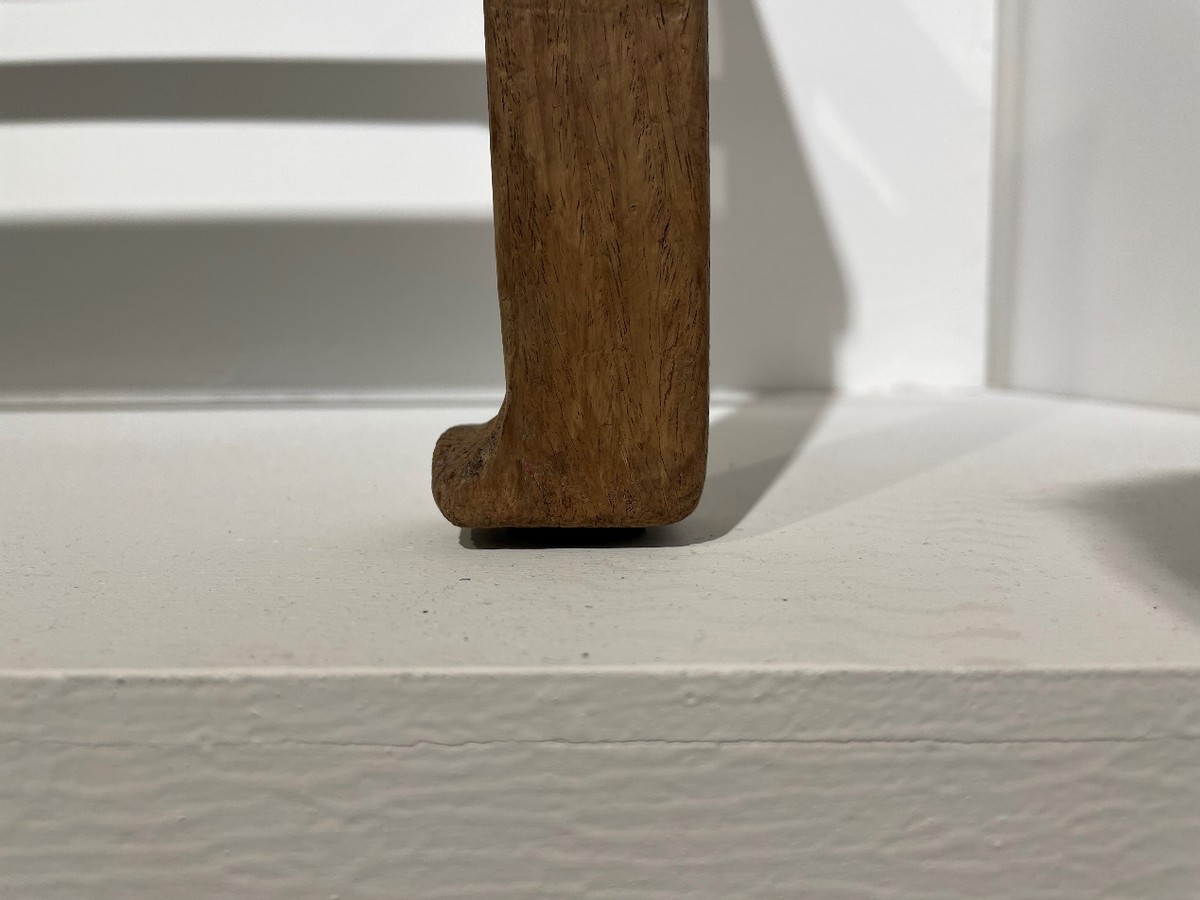 Worn, weathered, and decayed, the Qinghuanghuali spring stool is old to ...