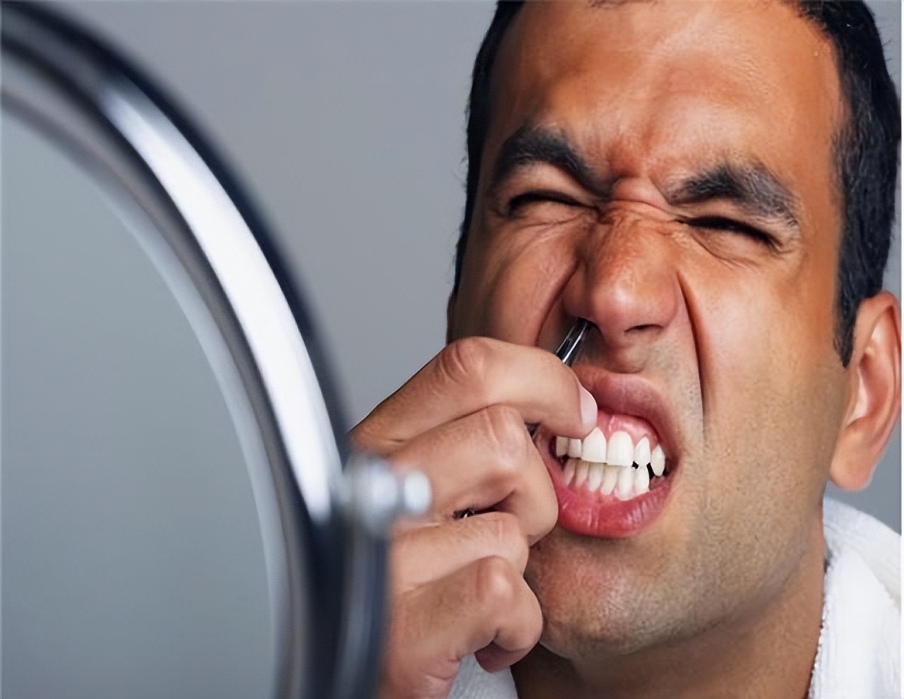 Increased knowledge: what does the man with nose hair "snap out" imply ...