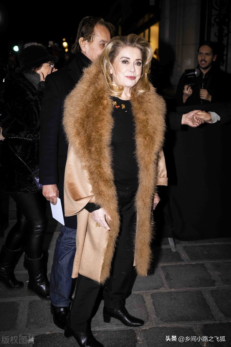 Catherine Deneuve is wearing a fur coat + black sweater elegant and ...