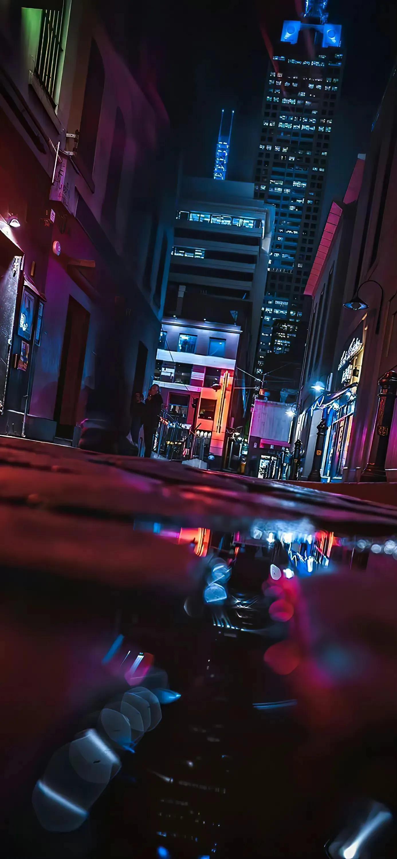 The bustling night scene of the city makes people intoxicated ...