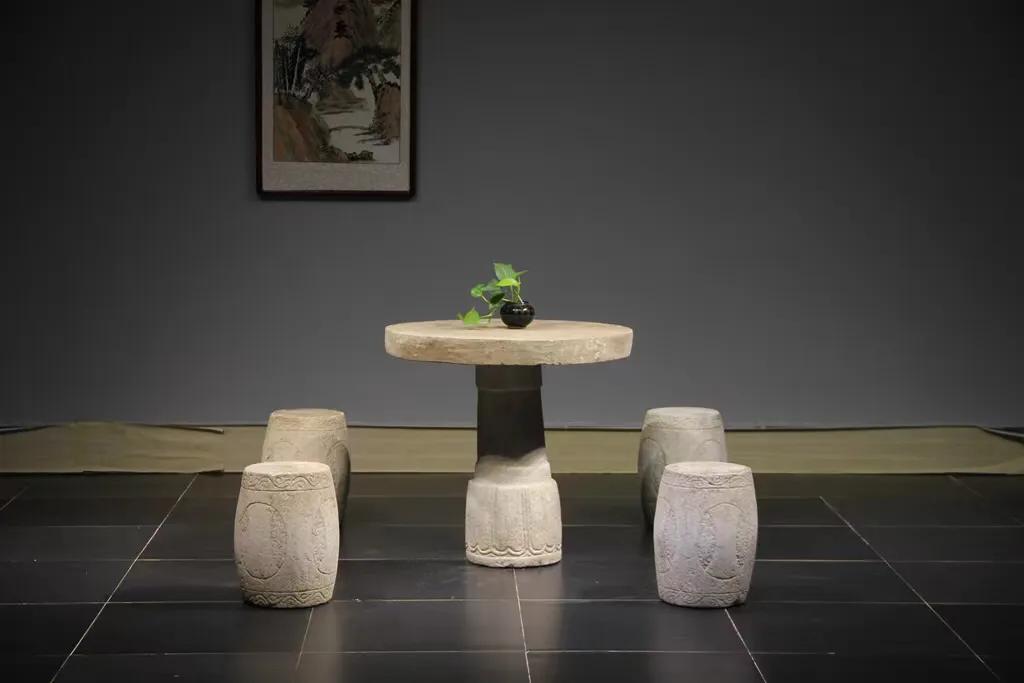 A set of stone tables A set of blue and white stone table tops are ...
