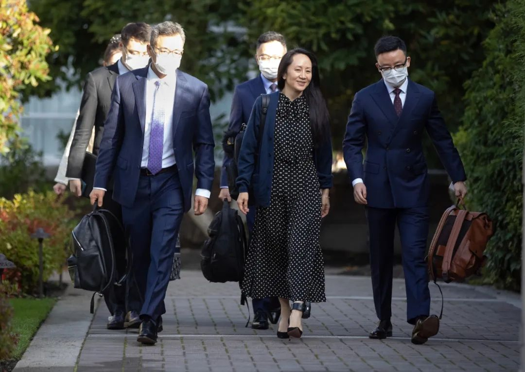 Meng Wanzhou made a high-profile appearance, wearing a pink dress and a ...