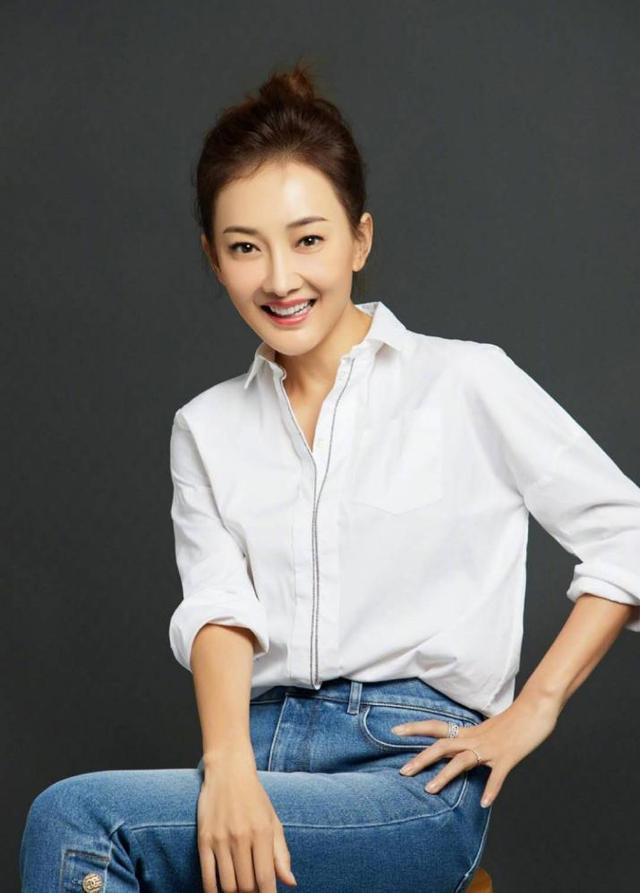 The group photo of Niu Li and her husband is in excellent condition ...