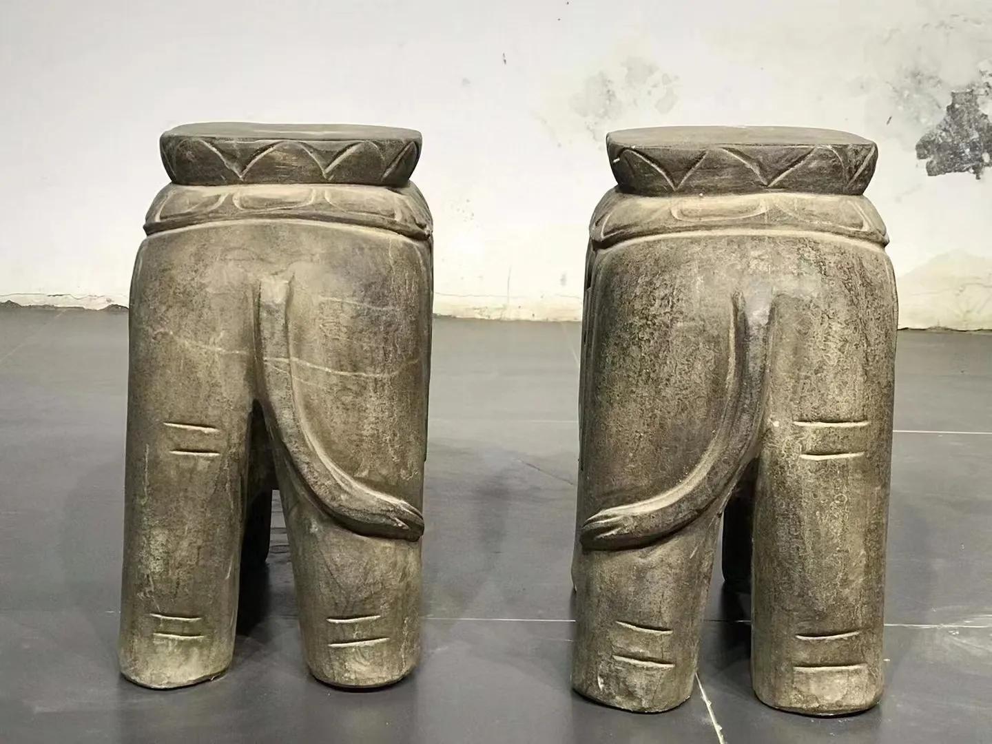 A pair of bluestone painted lucky elephants in size.40 long.The high 30 ...