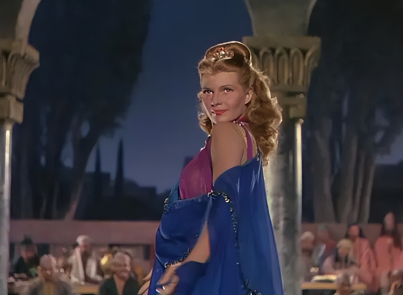 How does Hayworth's performance of "Salome" convey the emotional charm ...