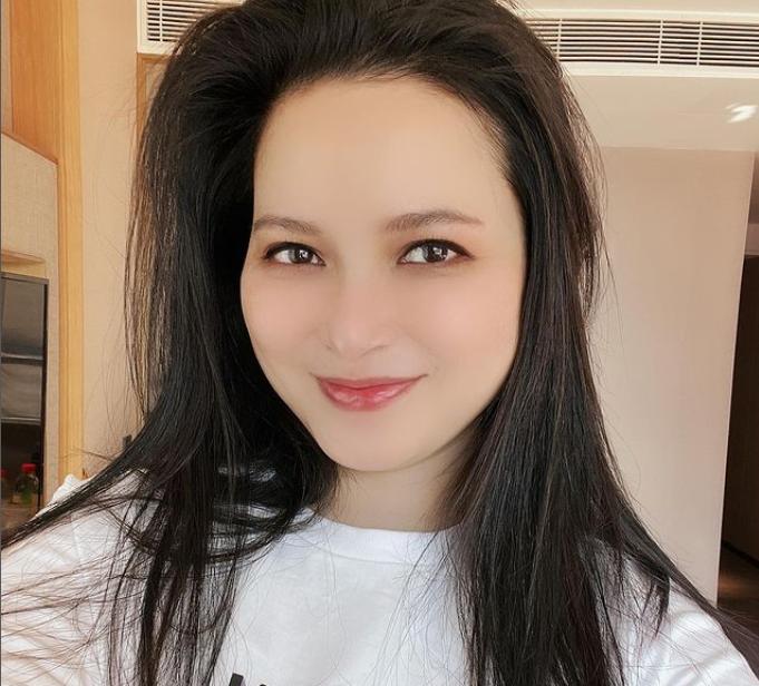 Lau Ka Fai has been paralyzed by a stroke for 11 years and rarely shows ...