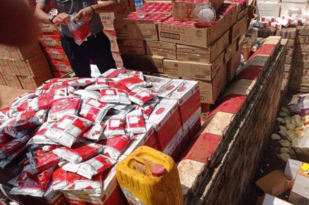 Authorities in Lashio, Myanmar focus on destroying smuggled food with a ...