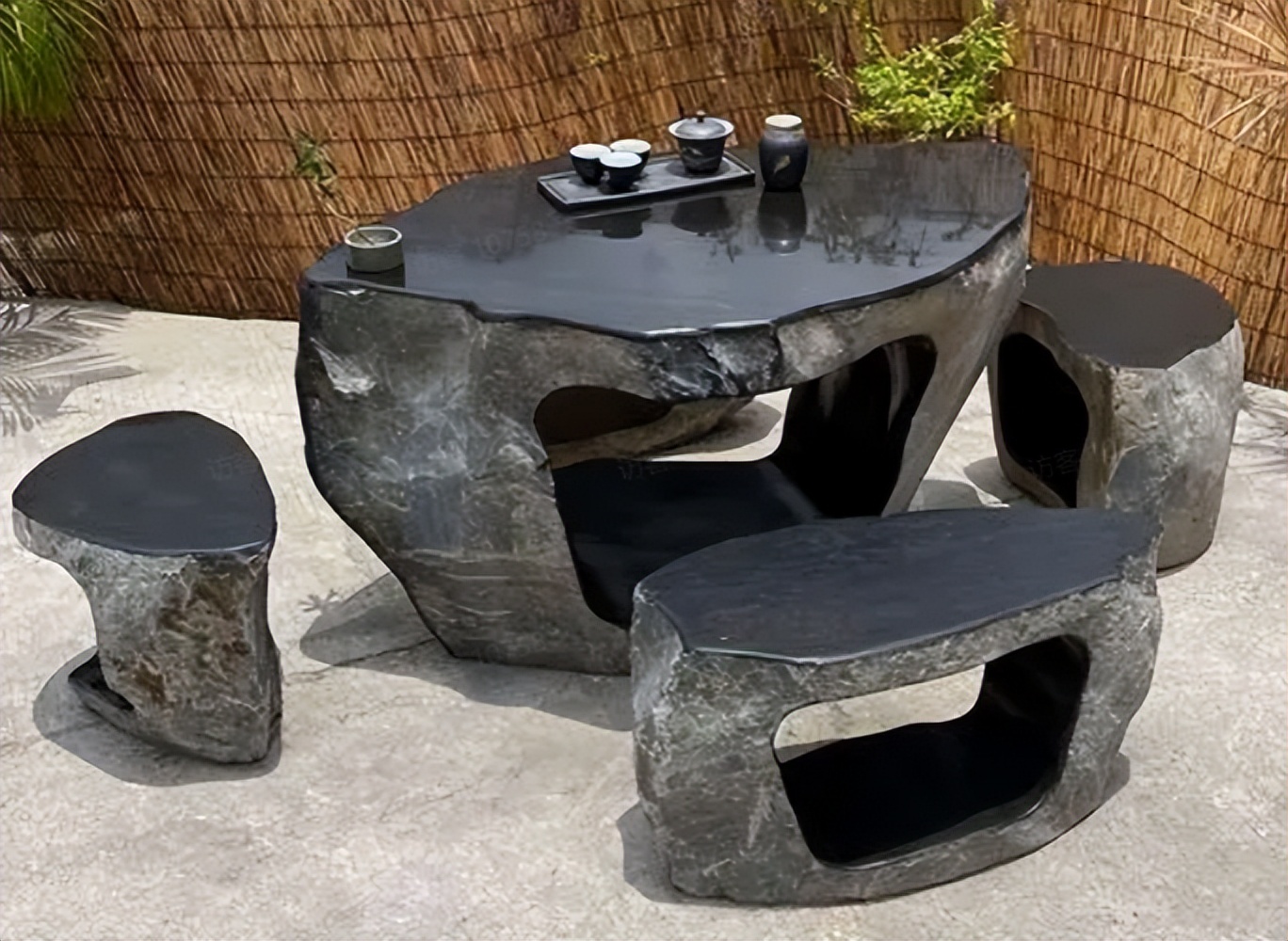 Ancient stone stone chair, carved from a large block of stone, has a ...