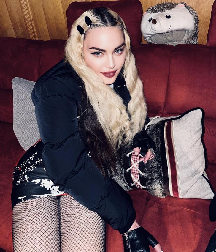 The 64-year-old Madonna took photos of the family party, hugged and ...