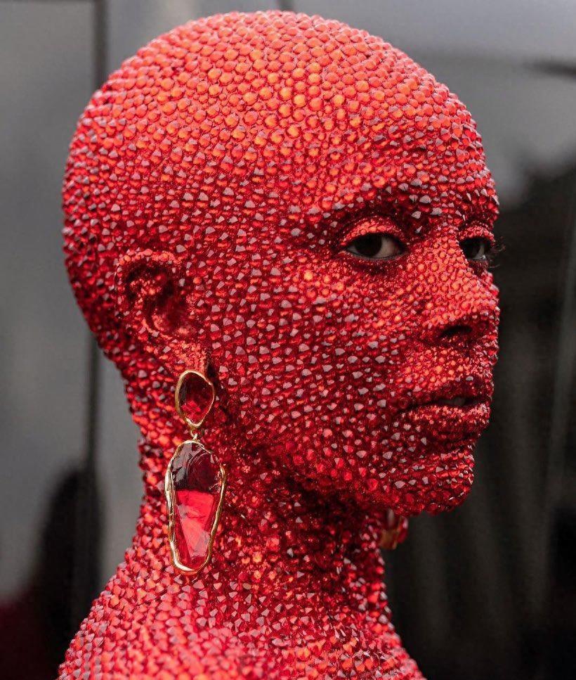 The actress' body is studded with 30,000 red crystals, which are ...