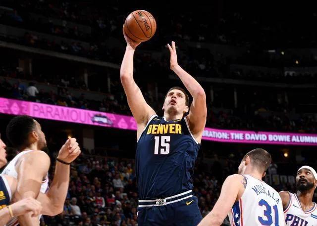 Jokic lightly stretches the ape arm to make a tip-up, Murray twists the ...