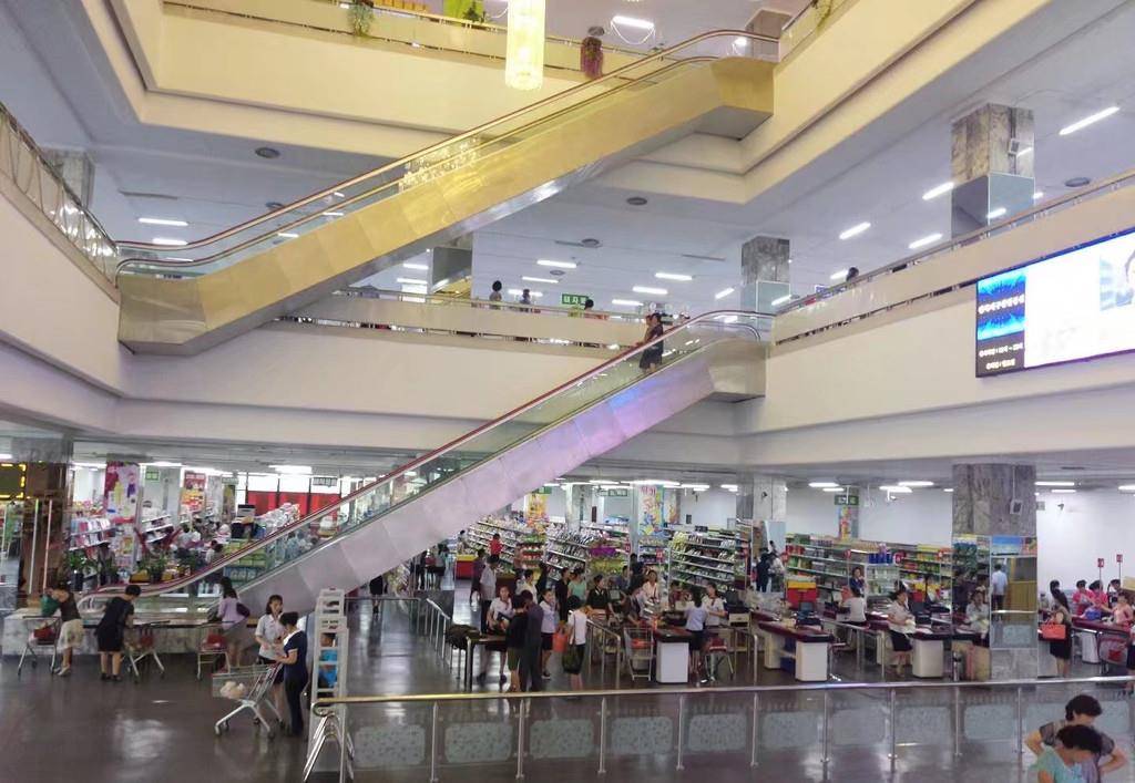 Walking into North Korea, the female cashiers in North Korean ...