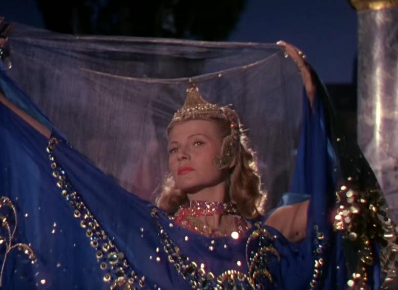 How does Hayworth's performance of "Salome" convey the emotional charm ...