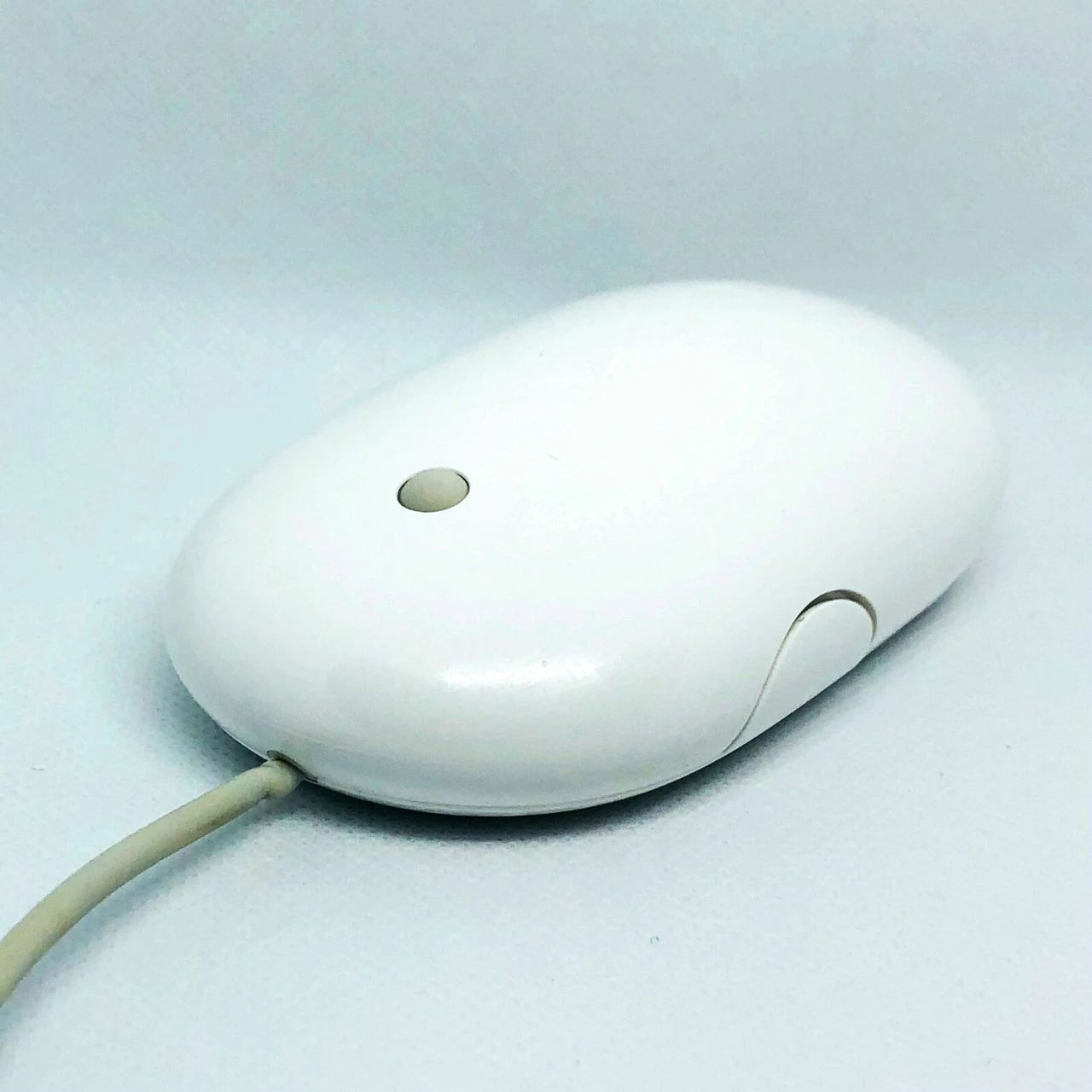business logic? Apple mouse changes from single button to double button ...