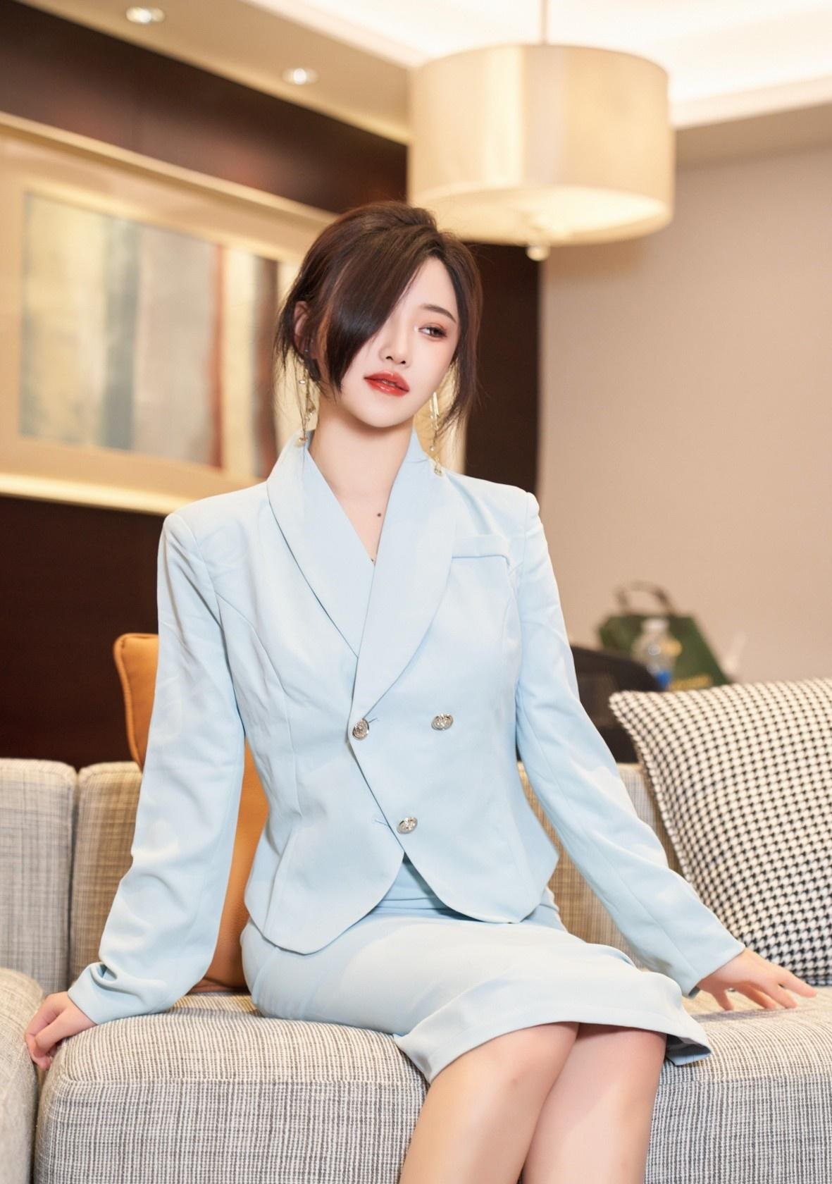 A must-have commuter outfit for fashionable women—a light blue suit ...