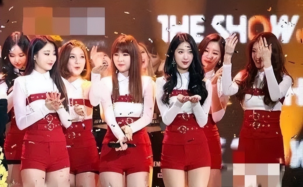 The female artist touches her genitals and licks her hands in a performance on campus. She is ...