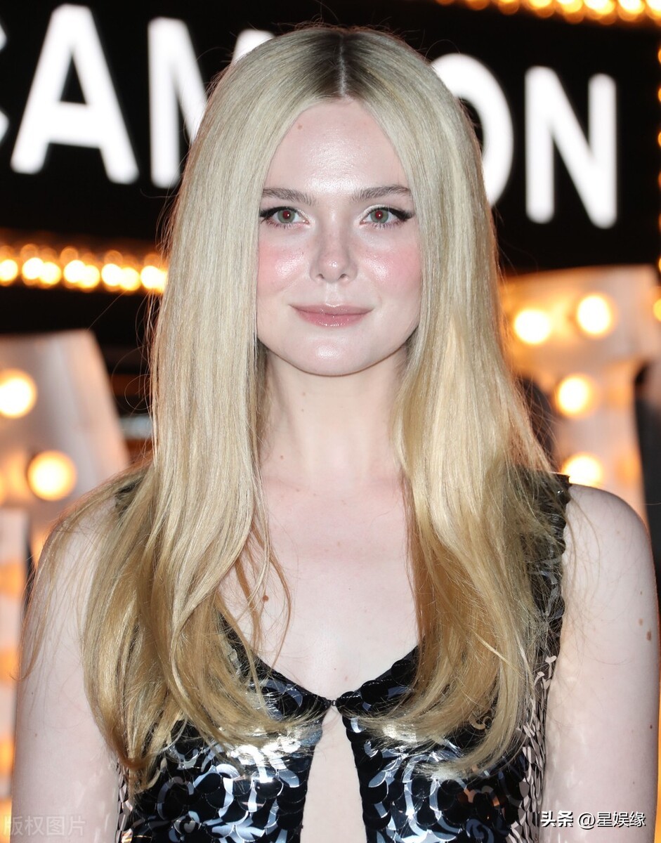 Elle Fanning is wearing a black camellia vest + patent leather pants ...